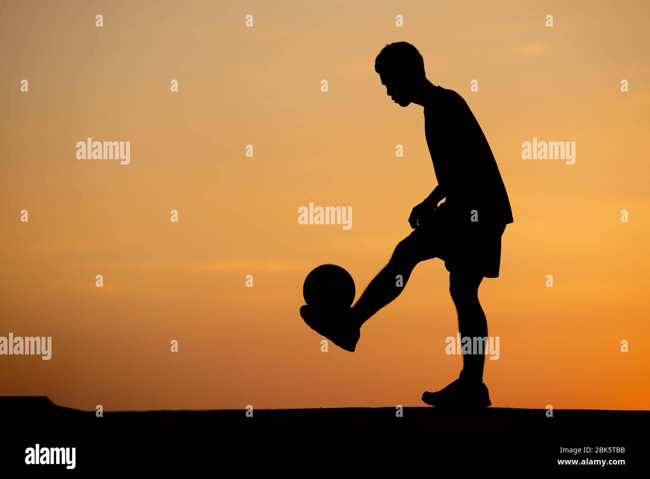Kids playing soccer sun in sky hi-res stock photography and images - Alamy