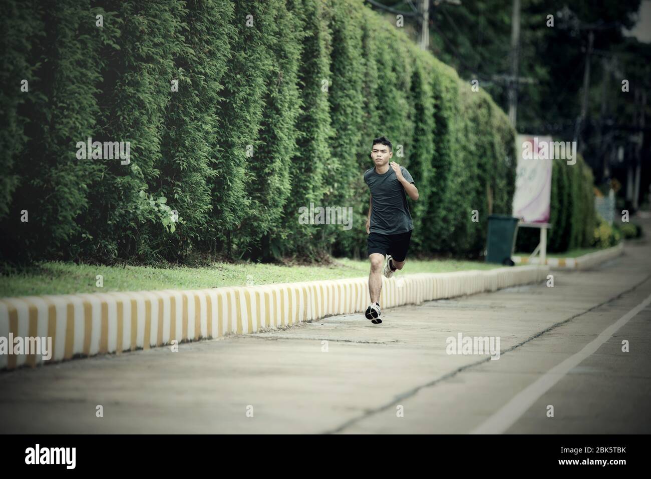 athlete standing on an all-weather running track Stock Photo - Alamy
