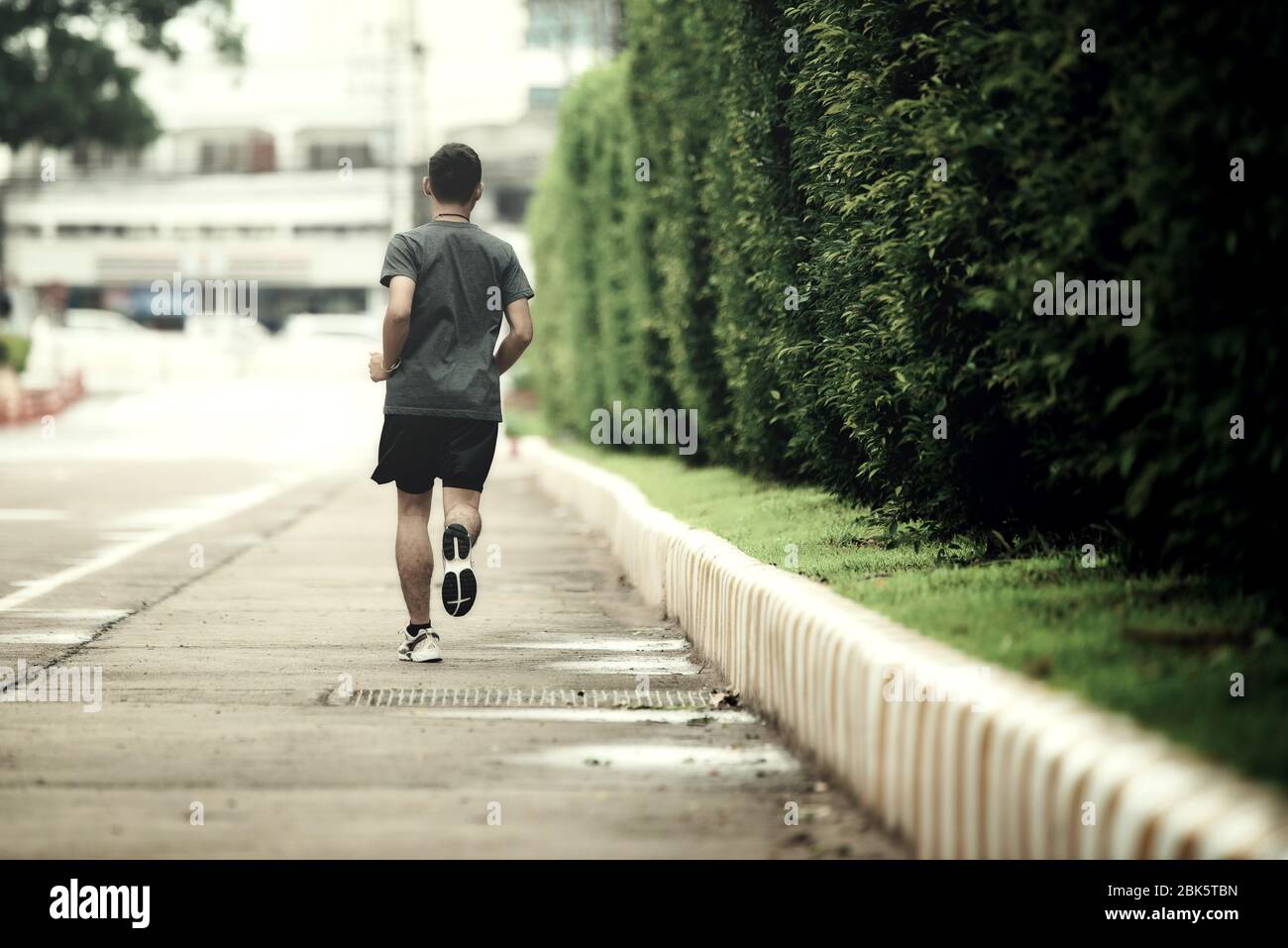 athlete standing on an all-weather running track Stock Photo - Alamy
