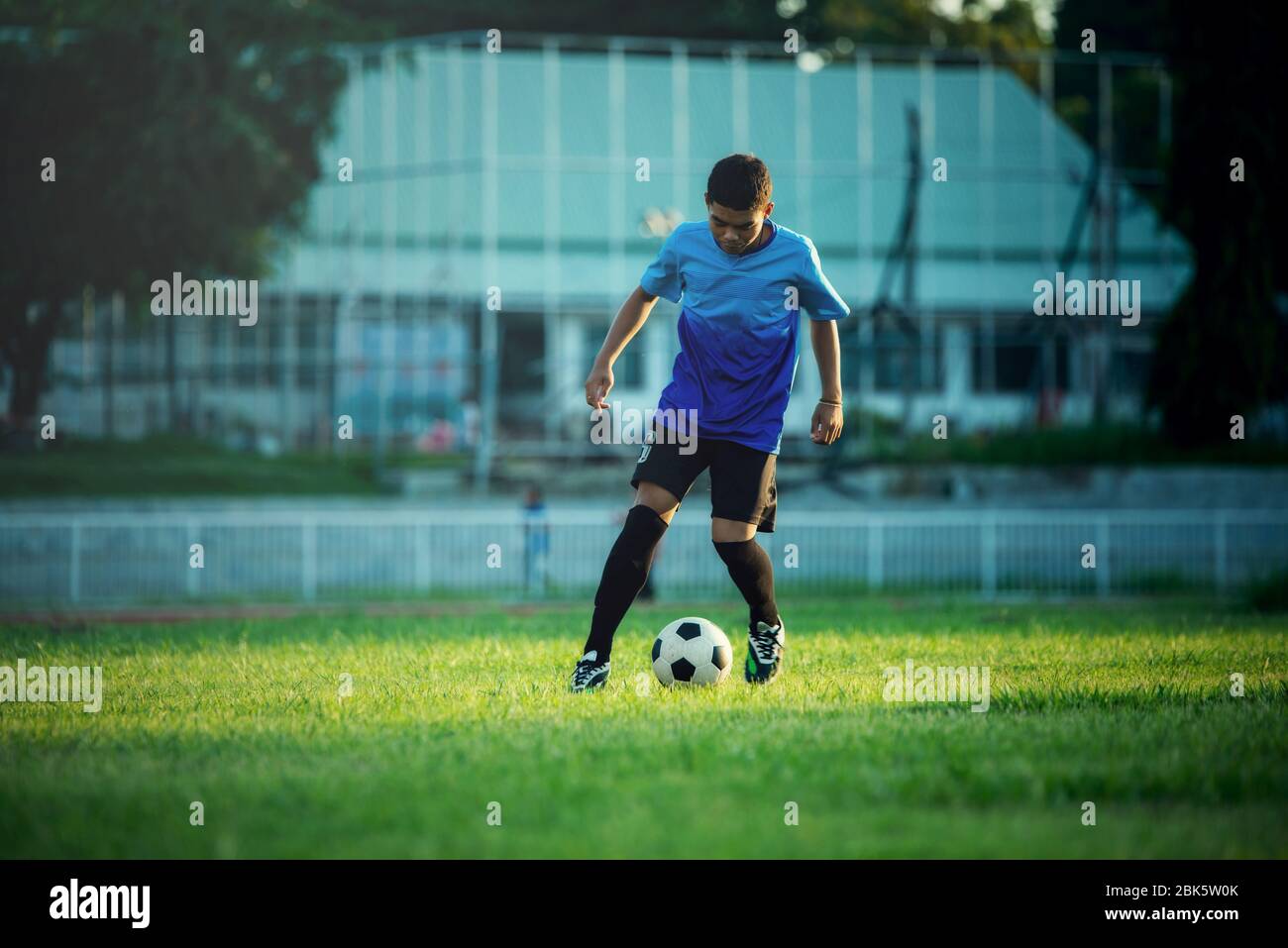 Soccer player action on the stadium Stock Photo - Alamy