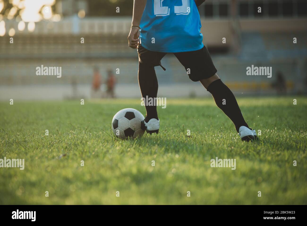 Soccer player action on the stadium Stock Photo - Alamy