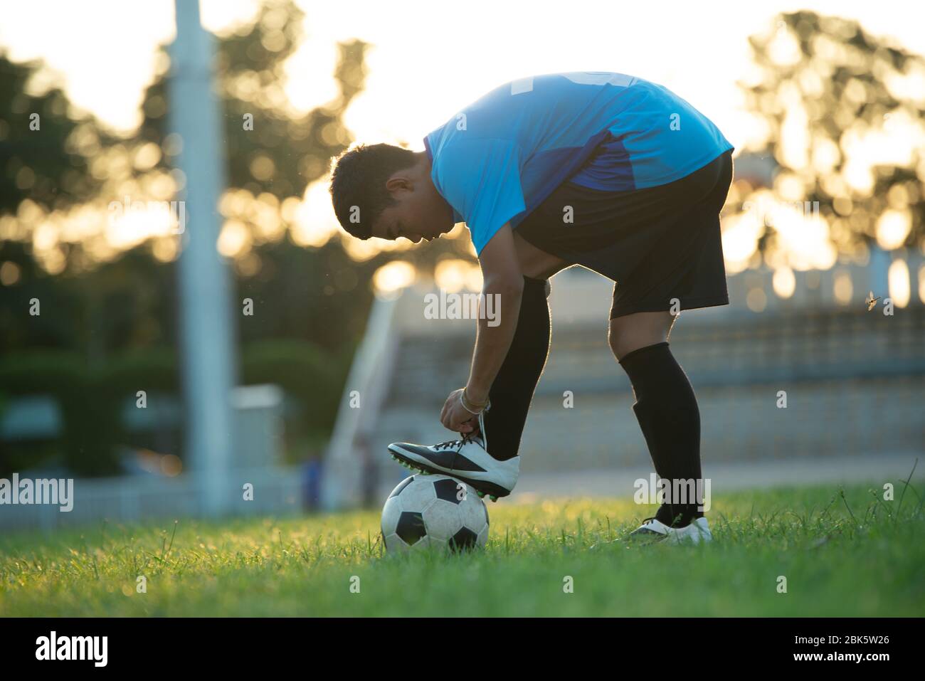 Soccer player action on the stadium Stock Photo - Alamy