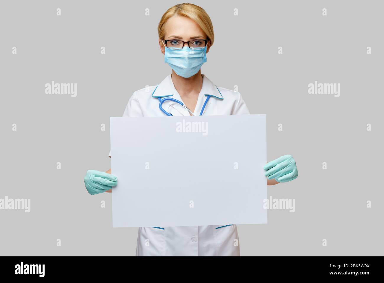 Nurse showing medical sign billboard standing hi-res stock photography ...