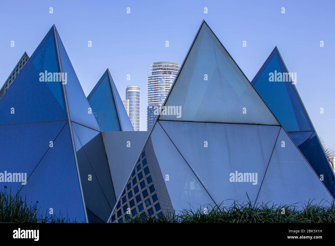 Glass pyramids against Azrieli Tower in Tel Aviv, Israel Stock Photo ...