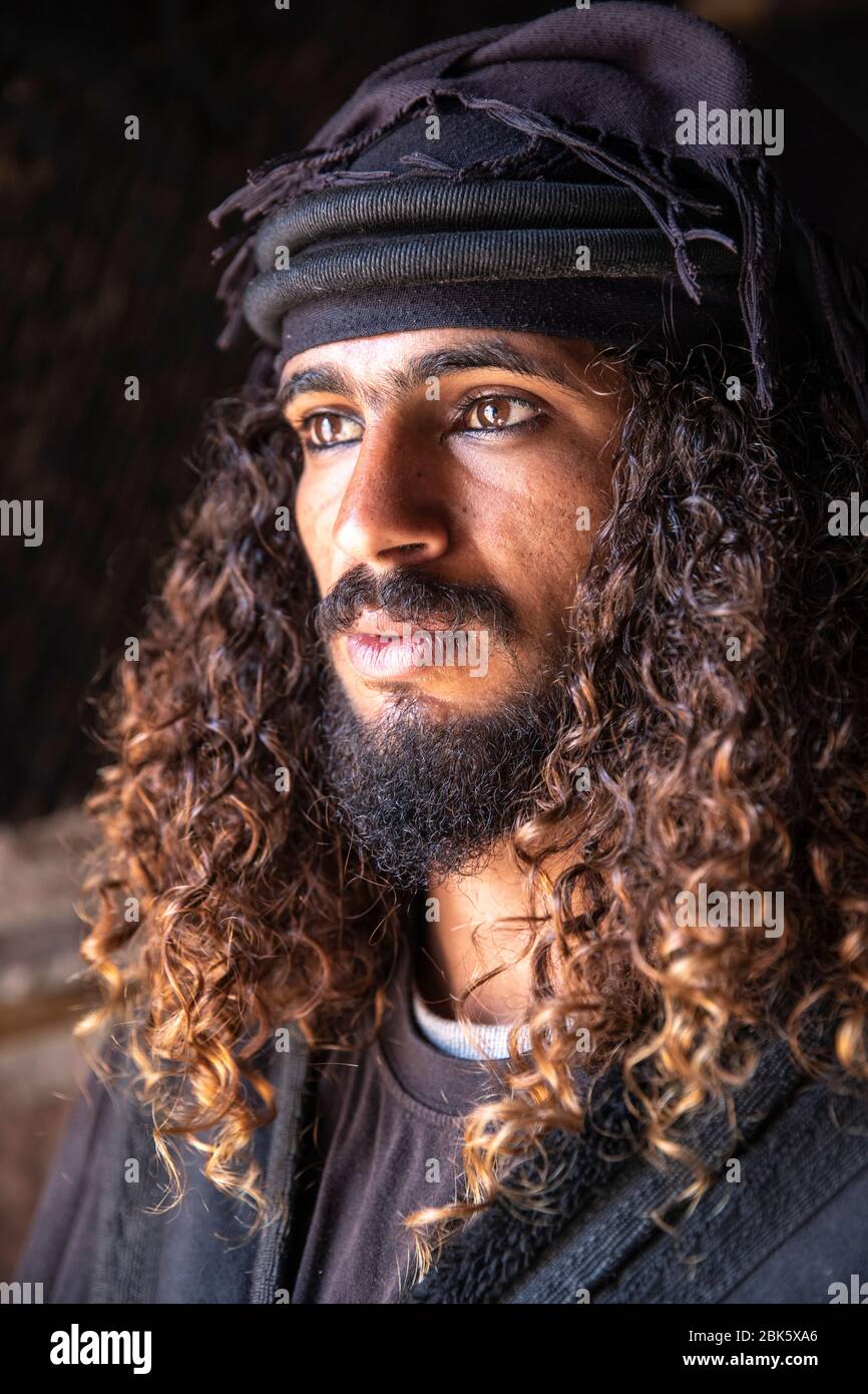 Bedouin and his donkey at the Ad Deir Monastery in the ancient ...