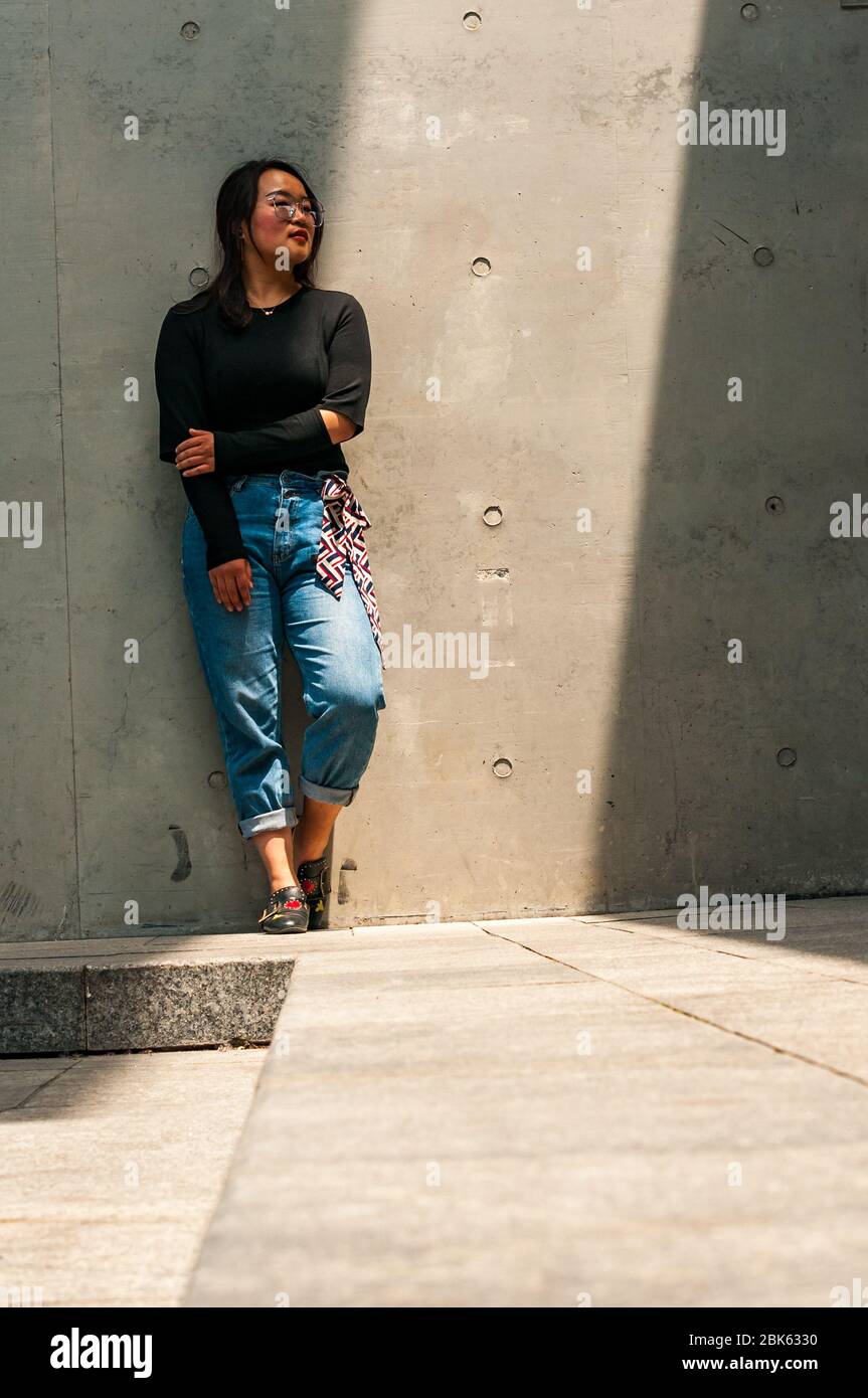 A young Chinese woman models in a ray of light at the Long Museum West ...