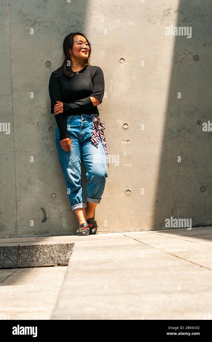 A young Chinese woman models in a ray of light at the Long Museum West ...