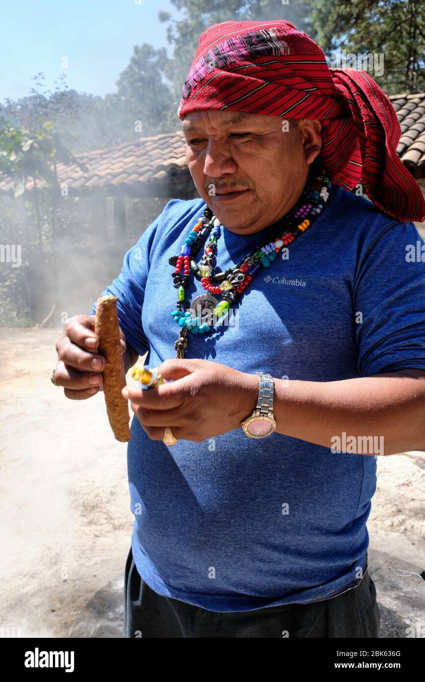 Shaman performing a Mayan healing ceremony for a family on the top of ...