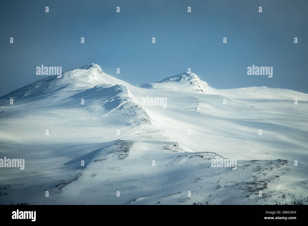 Winter landscape with dramatic snowy mountains Stock Photo - Alamy