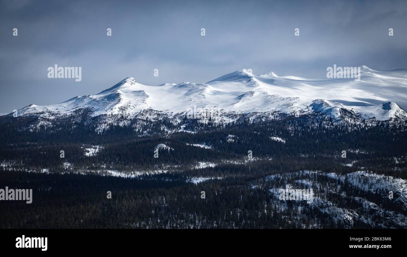 Winter landscape with dramatic snowy mountains Stock Photo - Alamy