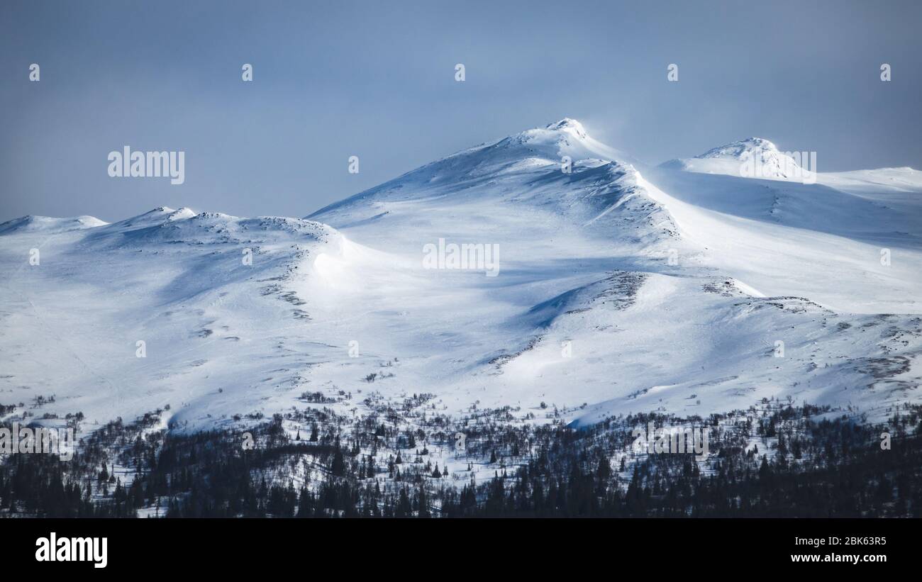 Winter landscape with dramatic snowy mountains Stock Photo - Alamy