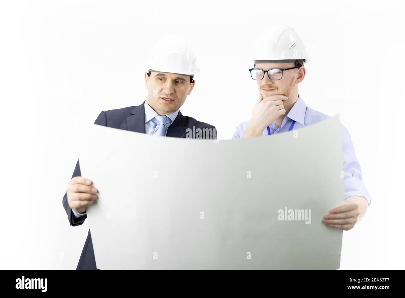 Engineers reading instructions, Engineer and businessman meeting, team ...