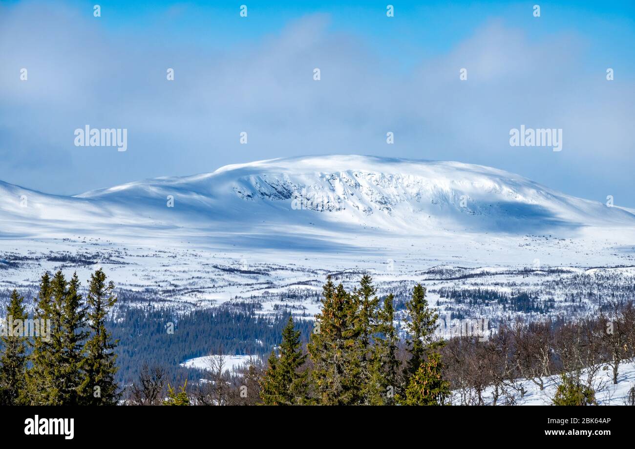 Winter landscape with dramatic snowy mountains Stock Photo - Alamy