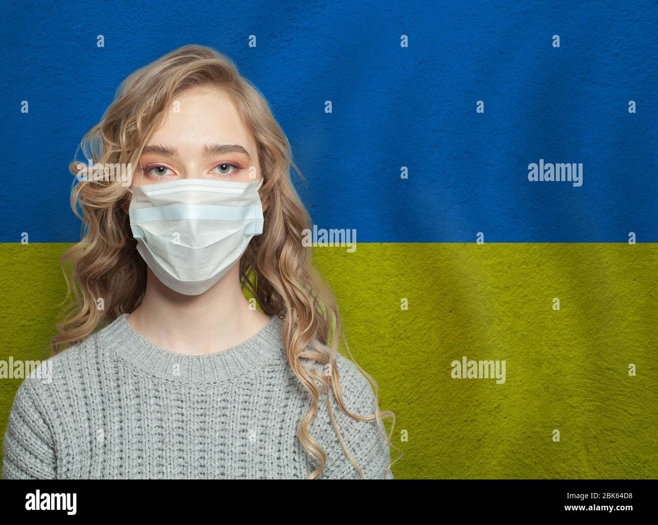 Young woman wearing a face mask with flag. Flu epidemic and virus ...