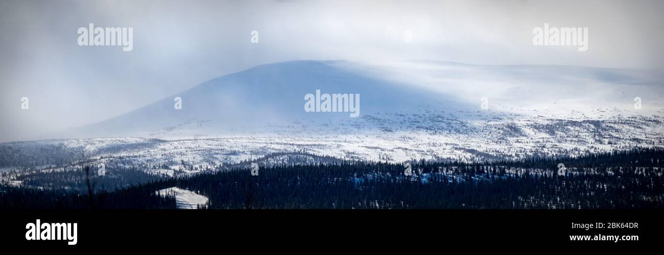 Winter landscape with foggy snowy mountains. Panorama Stock Photo - Alamy