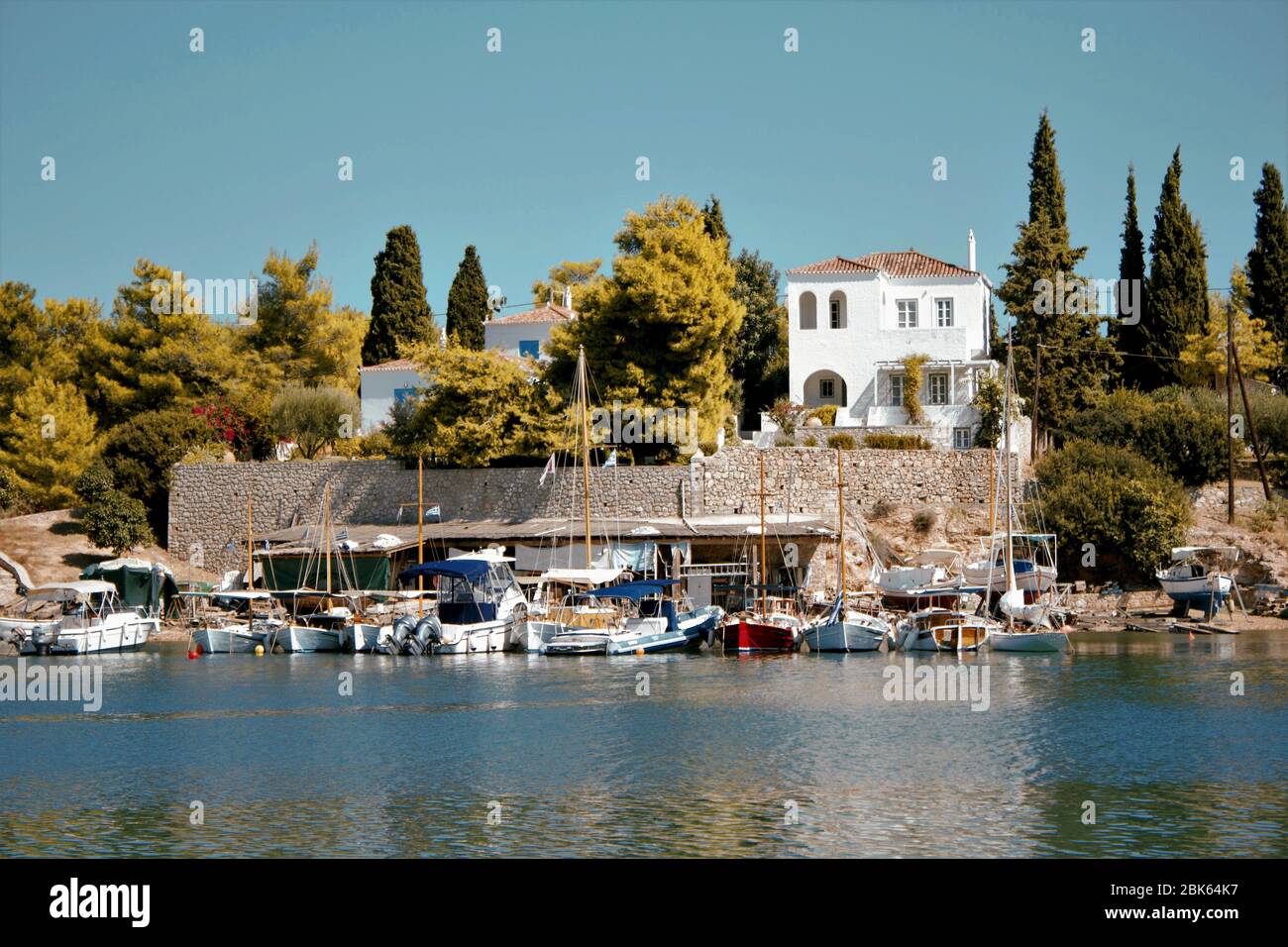 Scenic in the old harbor of Spetses island, Greece, with fishing boats ...