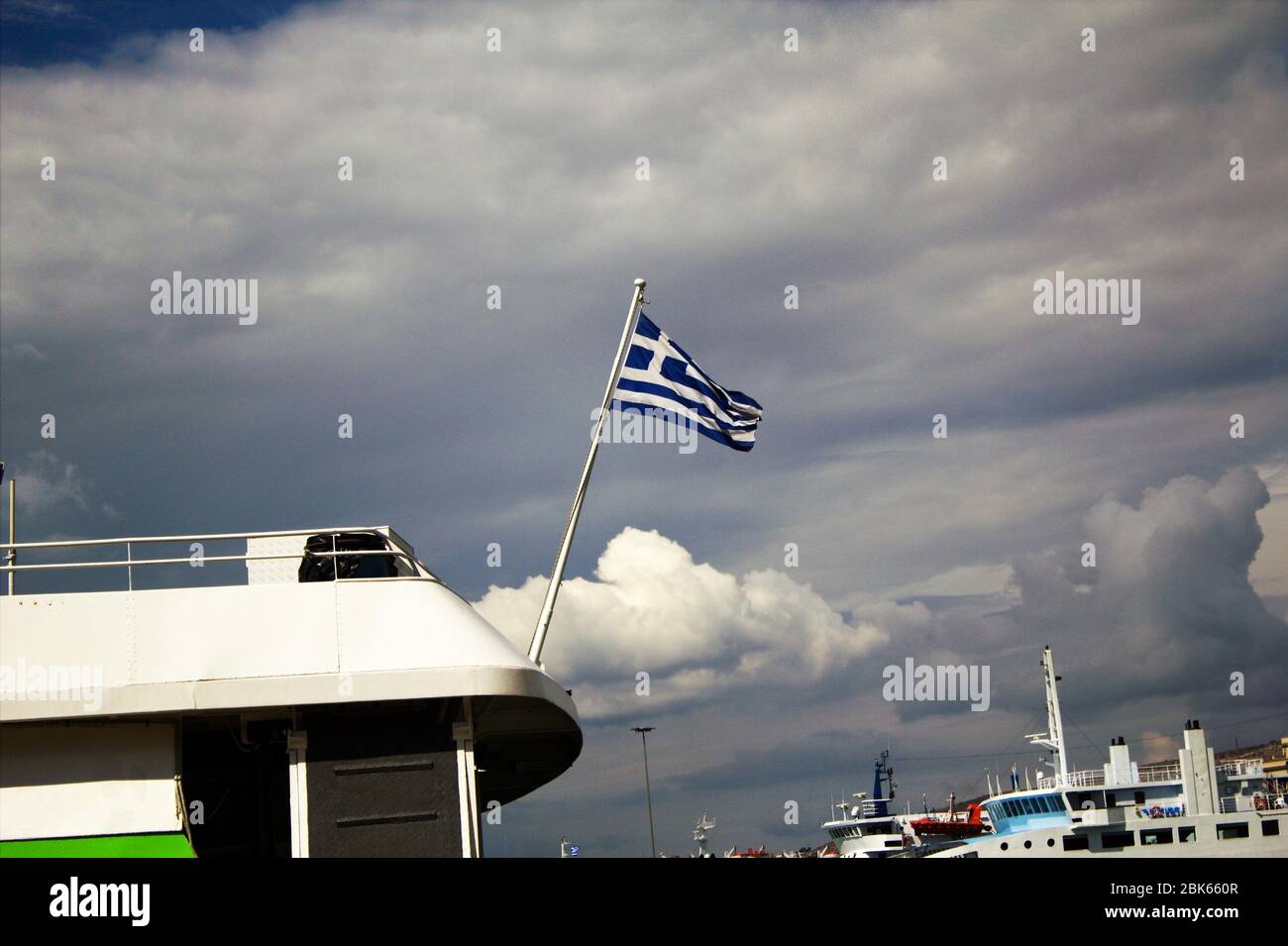 Greek flag waving on a flying cat at the port of Piraeus Stock Photo ...