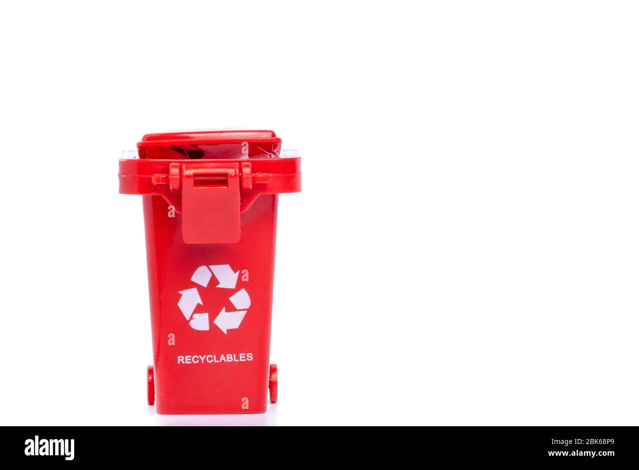 The red recycling bin isolated on white background Stock Photo - Alamy