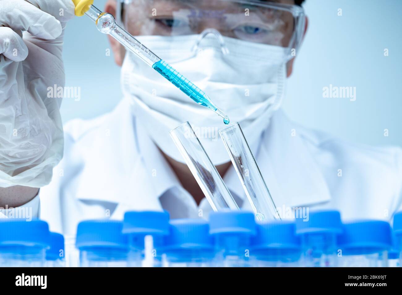 Asian male researcher working in the laboratory Stock Photo - Alamy