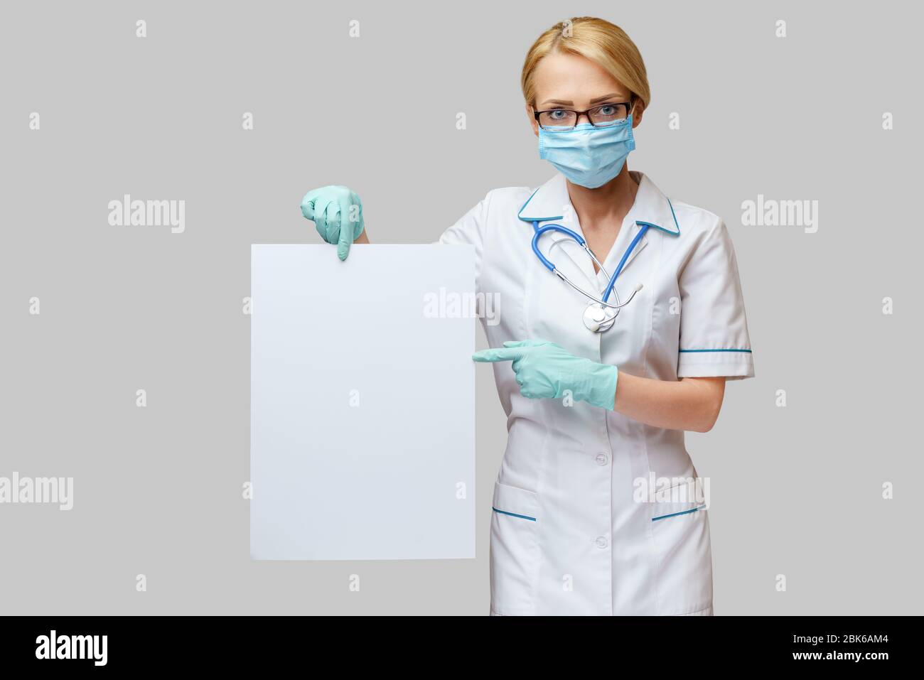 Nurse showing medical sign billboard standing hi-res stock photography ...