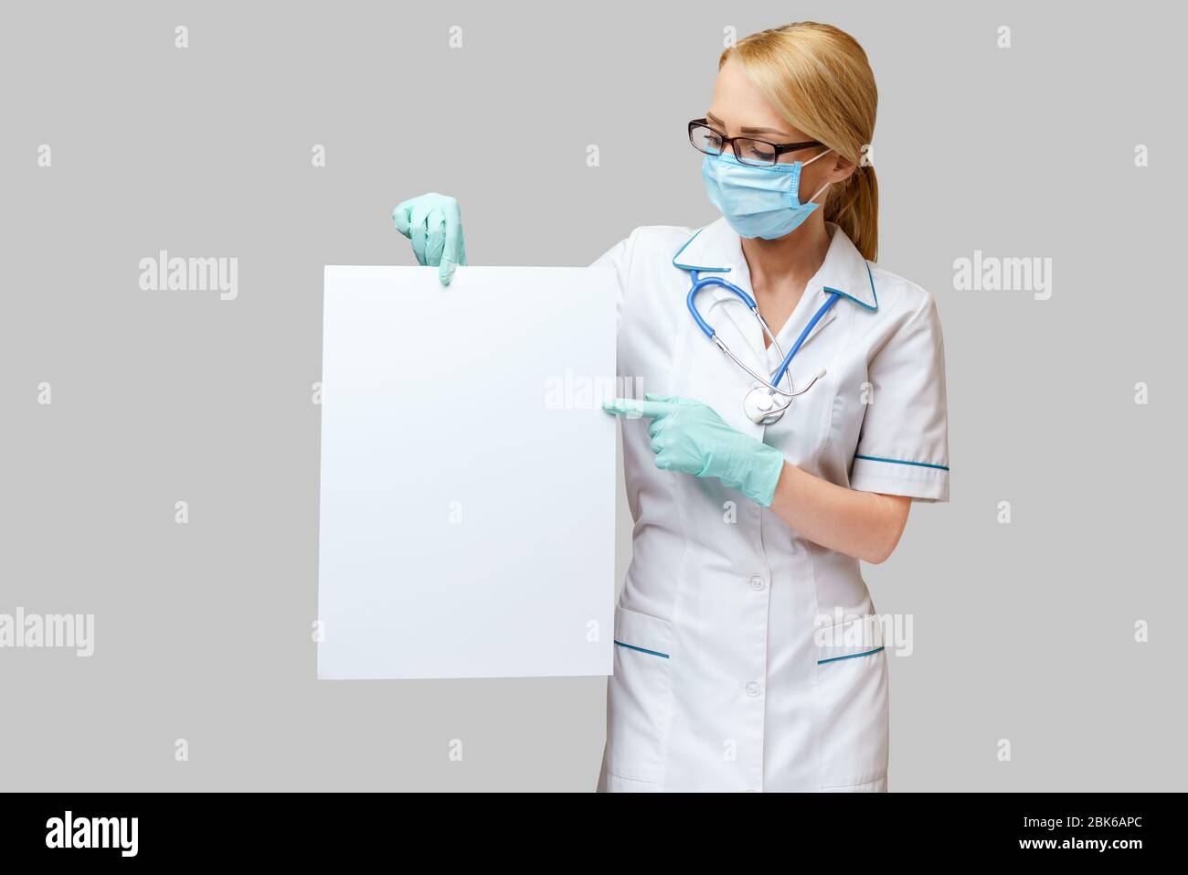 Nurse showing medical sign billboard standing hi-res stock photography ...