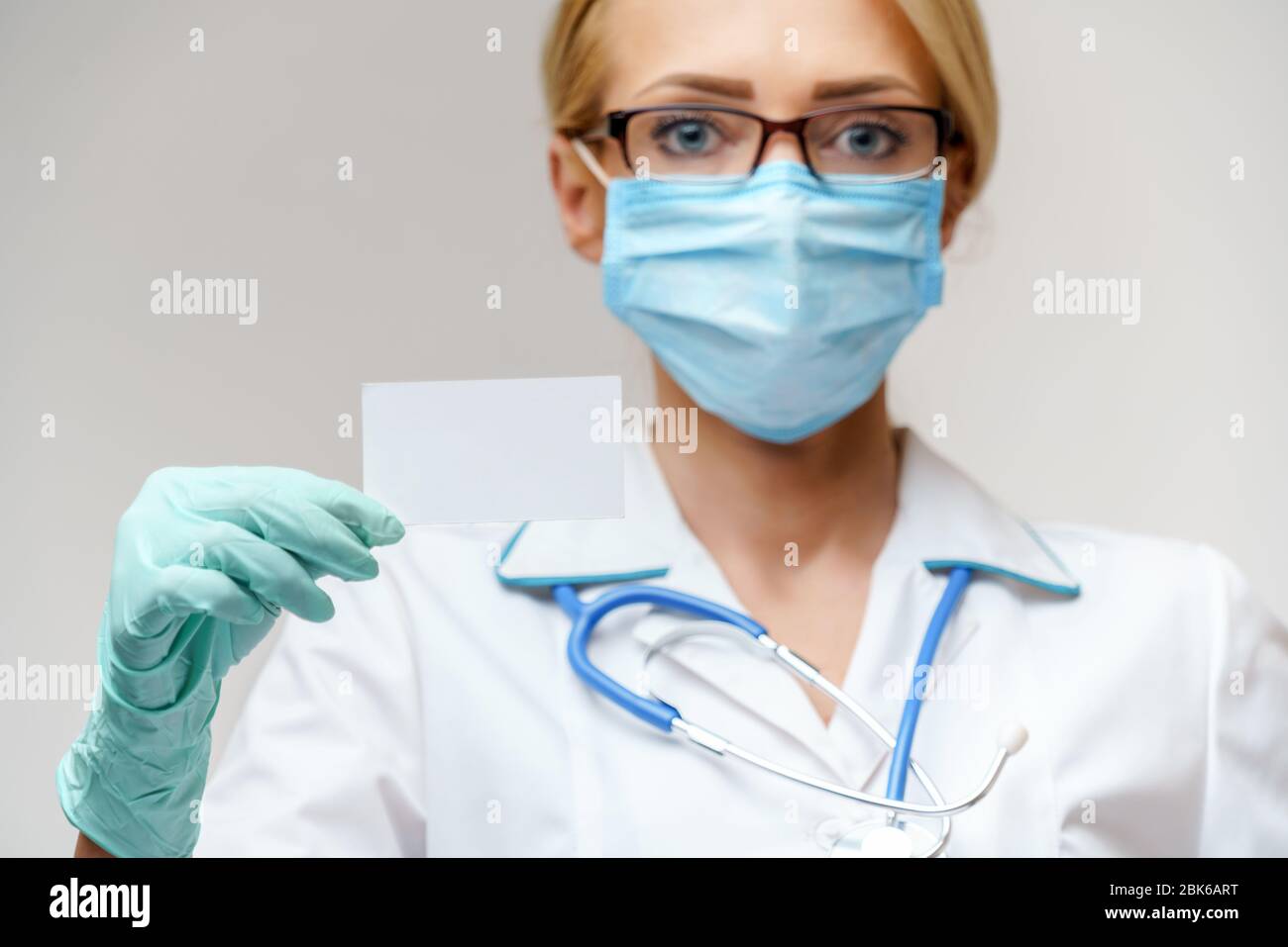 Doctor or woman nurse showing blank empty card with copy space Stock ...