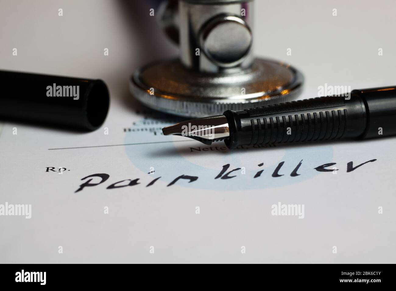 Macro closeup of isolated white prescription note, handwritten word ...