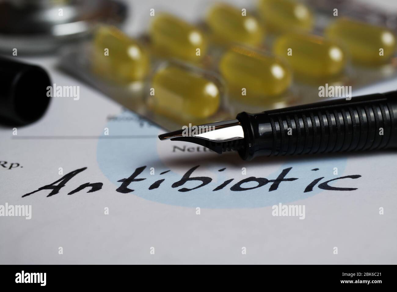Macro closeup of isolated white prescription note, handwritten word ...