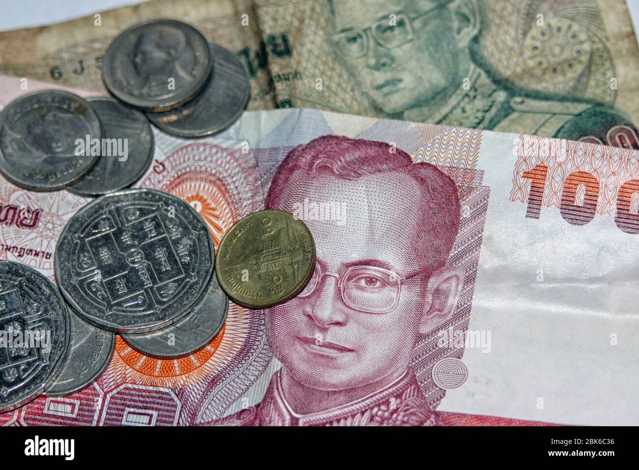 Thai currency (baht) in bills and coins Stock Photo - Alamy