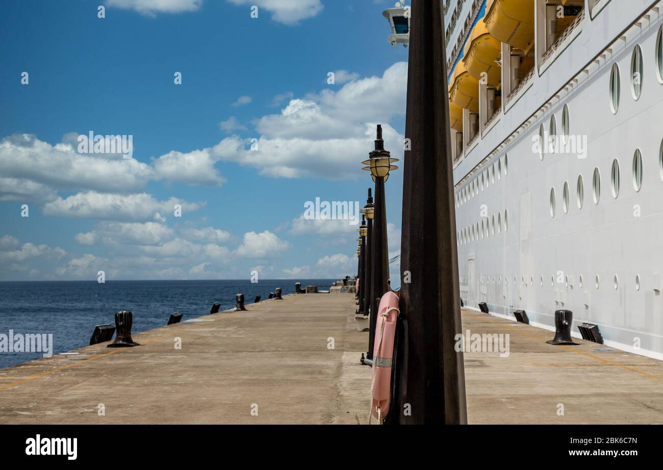 Light Posts on Pier by Cruise Ship Stock Photo - Alamy