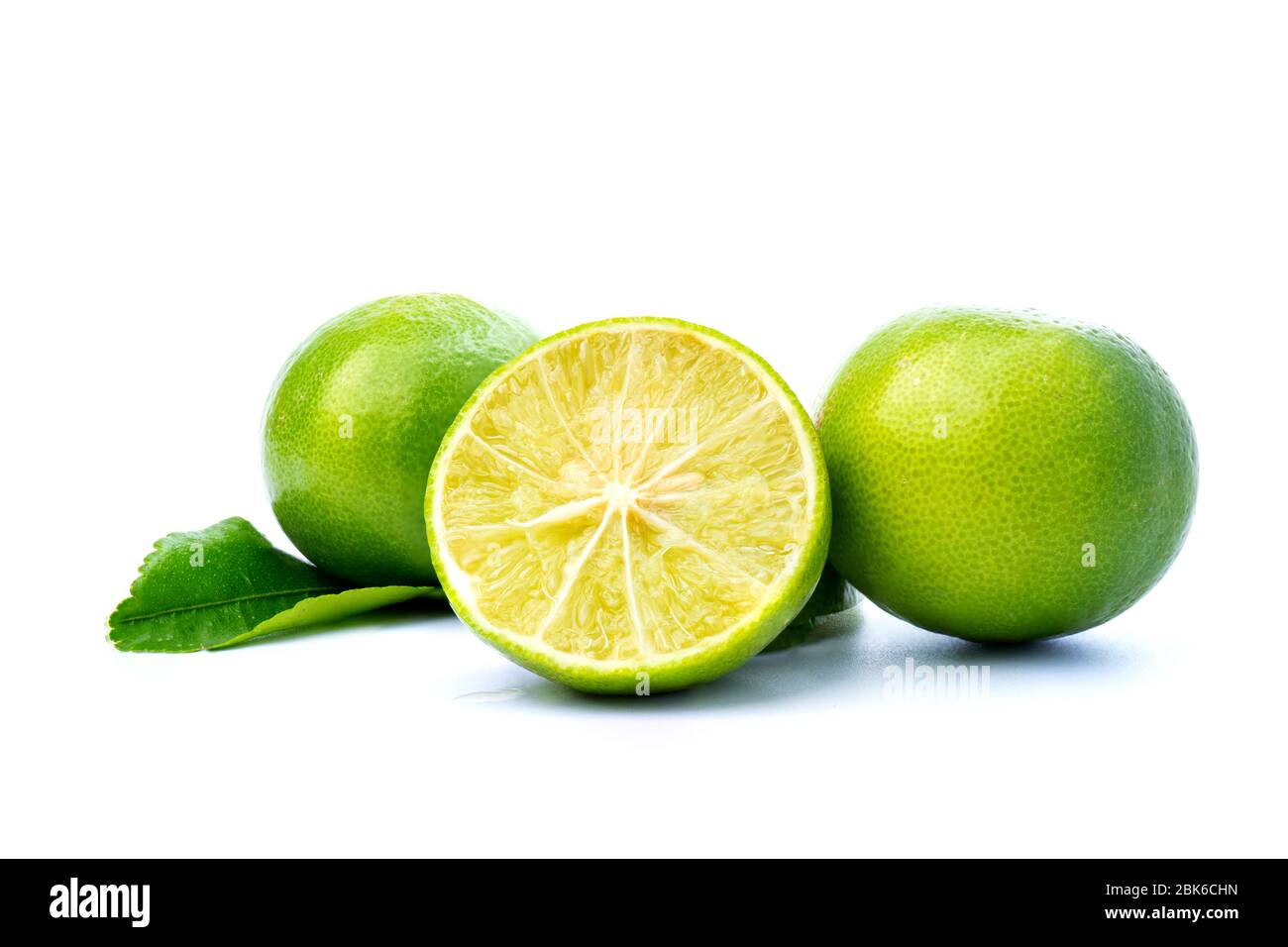 lime fruit with slice and cut piece isolated on white background Stock ...