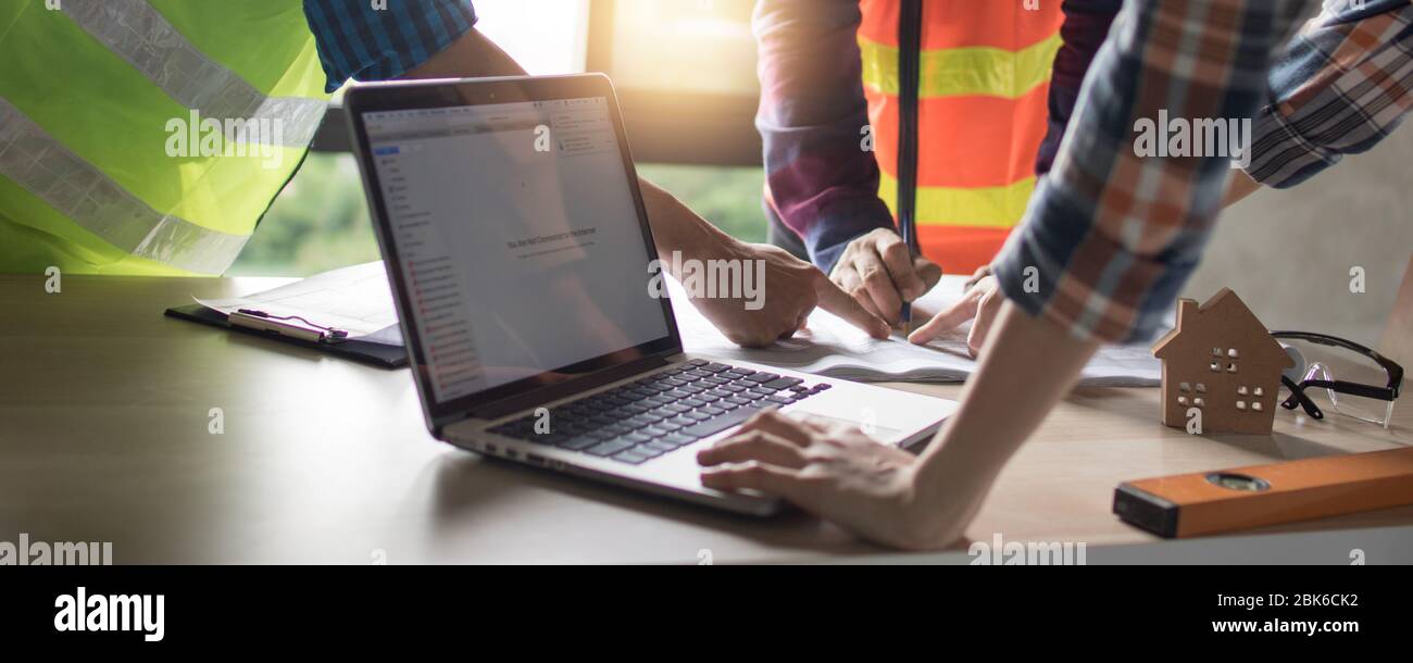 Engineer and worker planning for construction building and renovate in ...