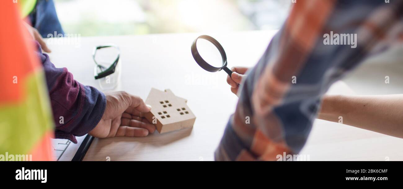 real estate and inspector concept, looking house model by magnifying ...