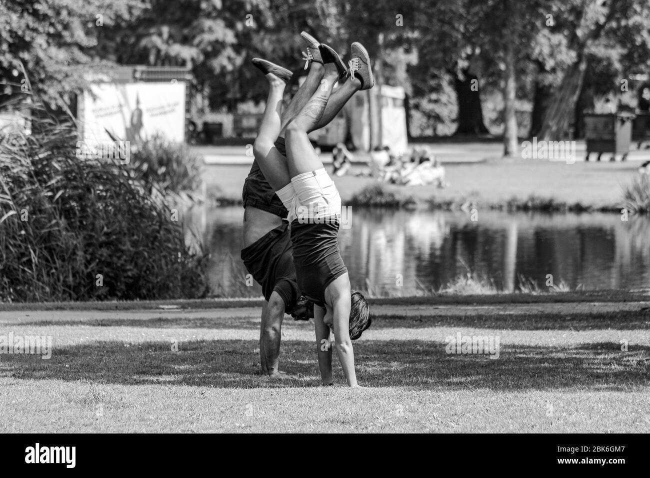 Handstands in park hi-res stock photography and images - Alamy