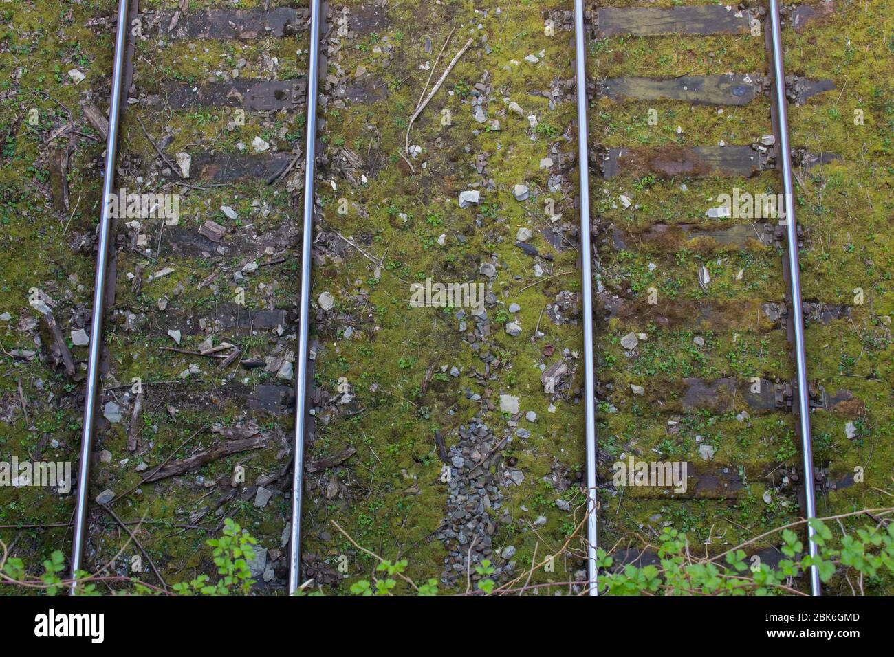 Top view of two parallel railway tracks with old wooden railroad ...