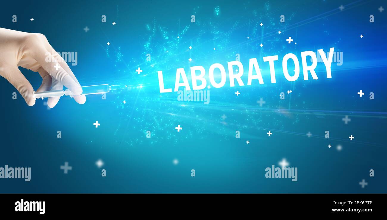 Syringe, medical injection in hand with LABORATORY inscription, medical ...