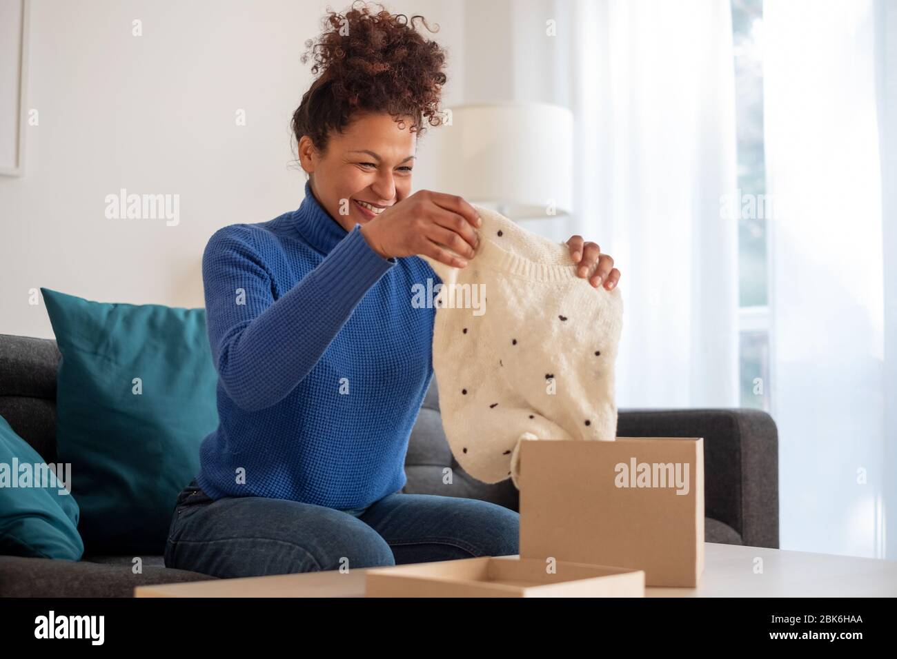 Unwrapping package hi-res stock photography and images - Alamy