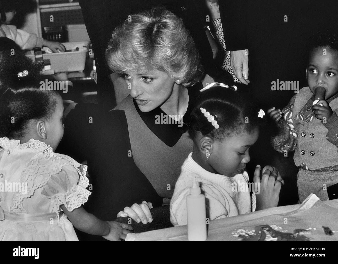 Princess Diana talking to homeless children at the Urban Family Center ...