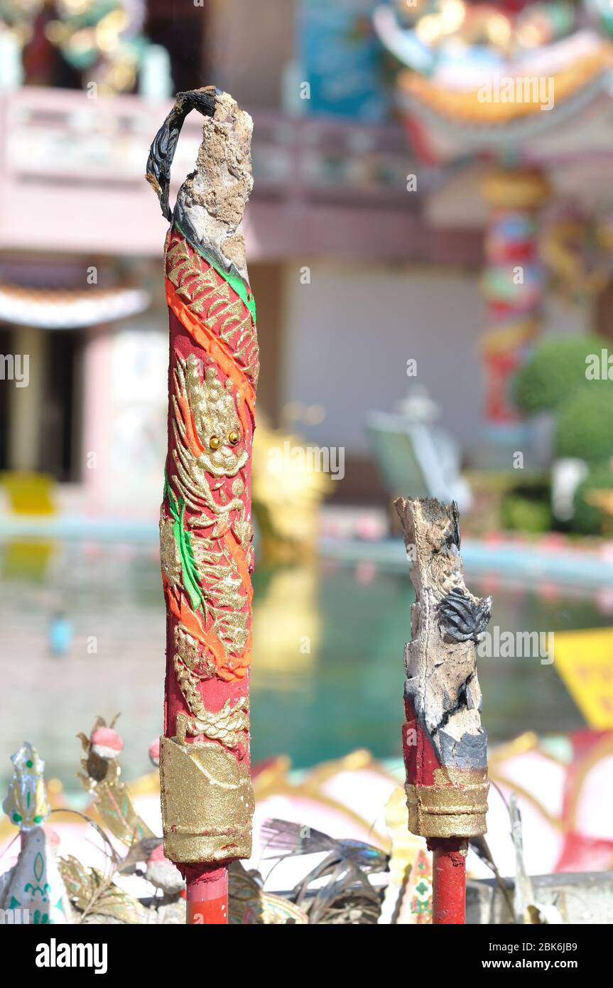 Red big incense with gold dragon pattern Stock Photo - Alamy