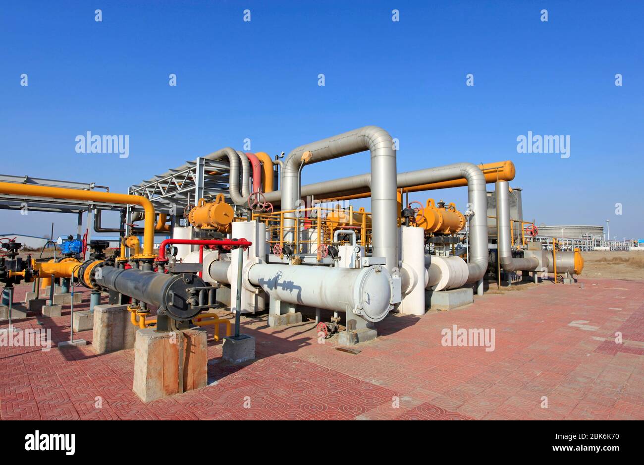 Oil field scene, oil pipelines and facilities Stock Photo - Alamy