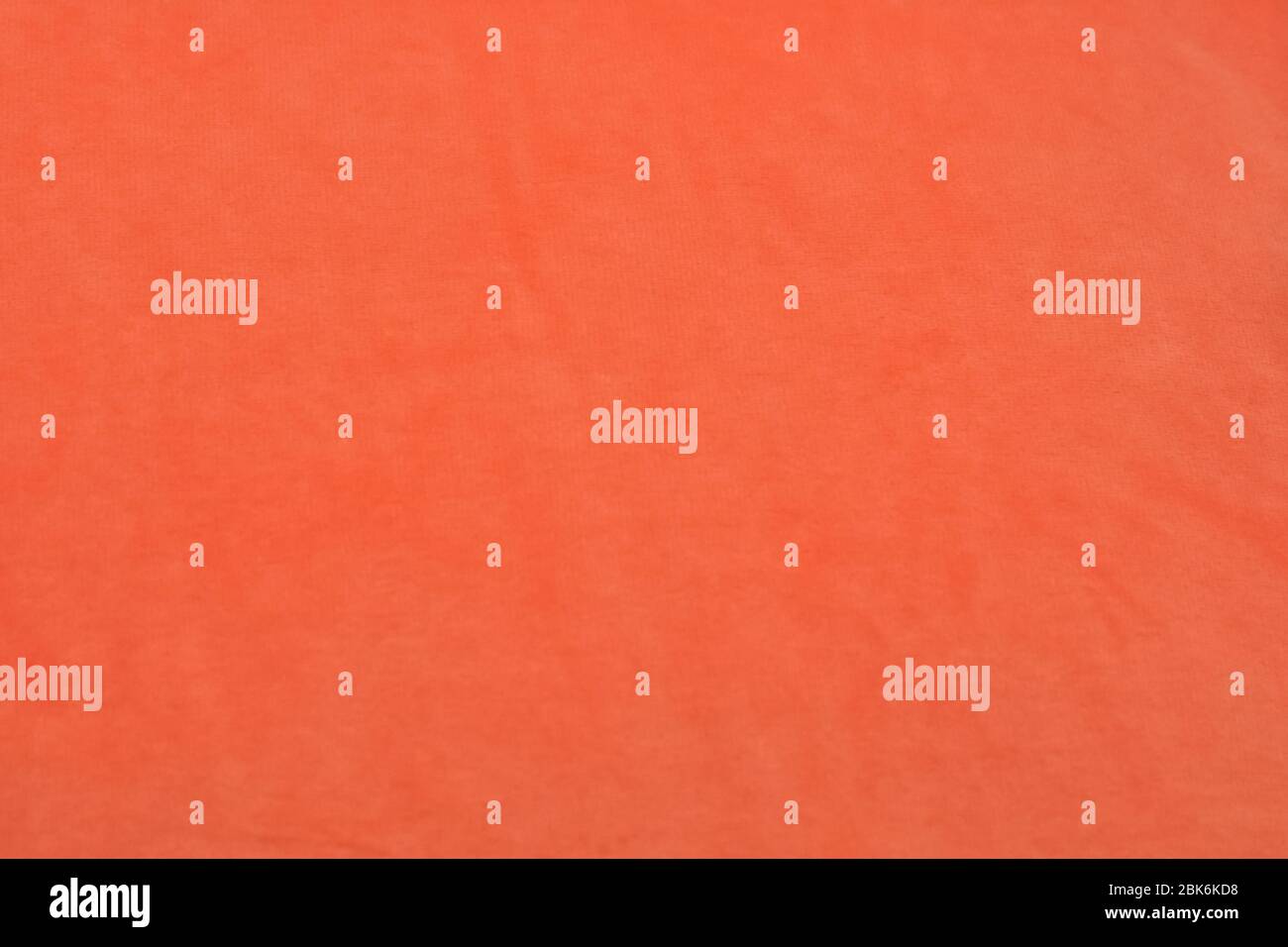 Bright orange velvet fabric background Stock Photo - Alamy