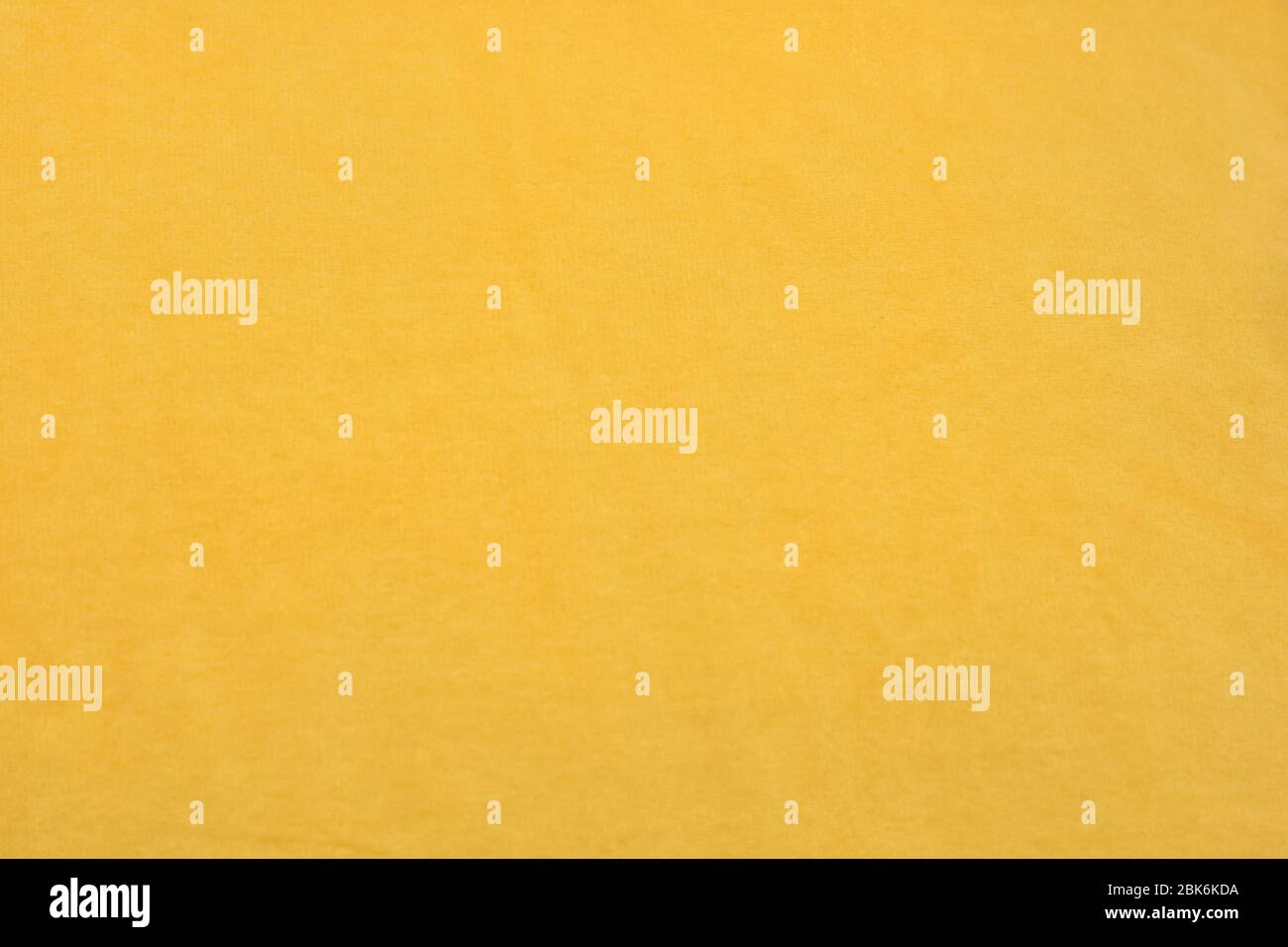 Bright yellow velvet fabric background Stock Photo - Alamy