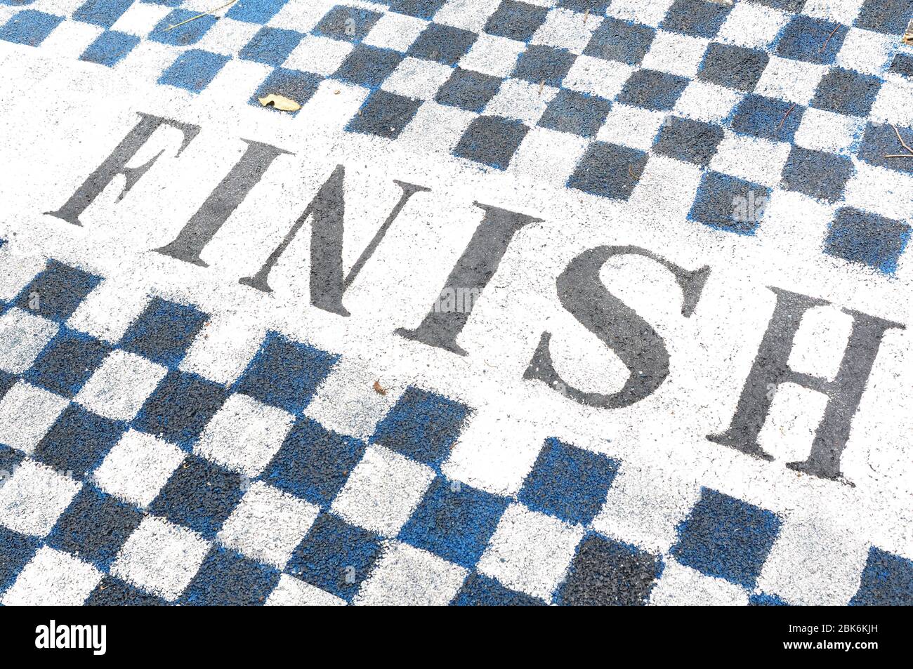 Finish label on jogging lane in garden Stock Photo - Alamy