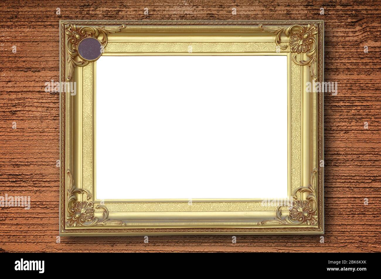 Gold picture frame on rough orange wall Stock Photo - Alamy