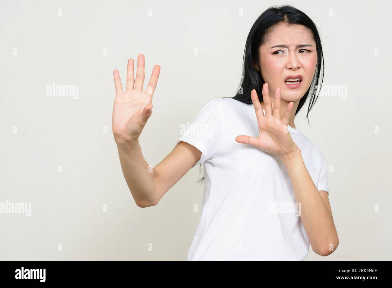 Portrait of stressed young Asian woman looking scared Stock Photo - Alamy