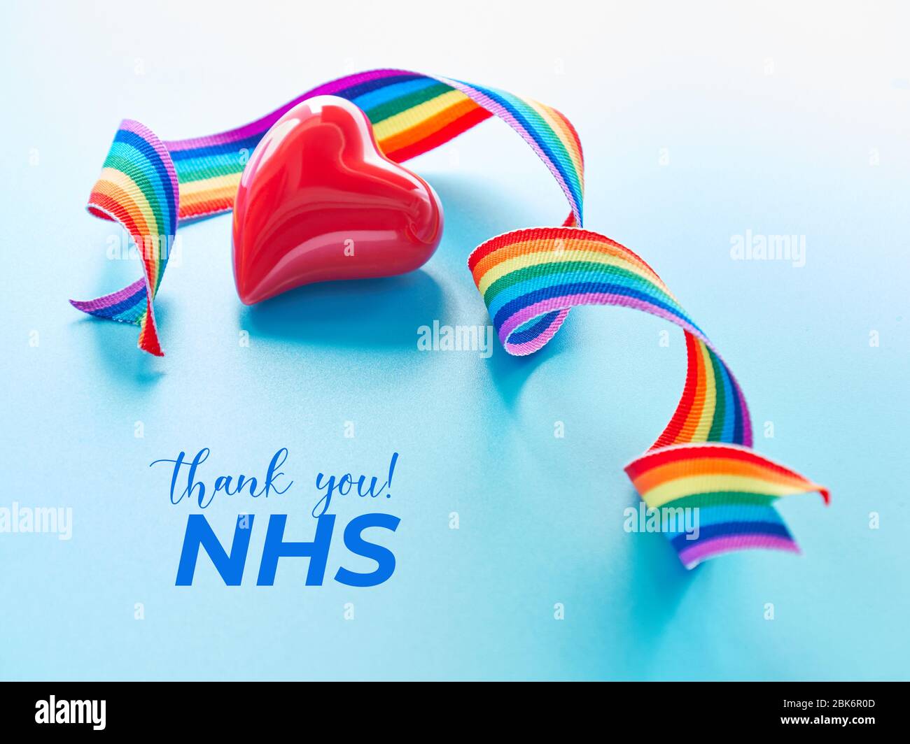 Red heart and rainbow ribbon, symbols of public support of NHS medical ...