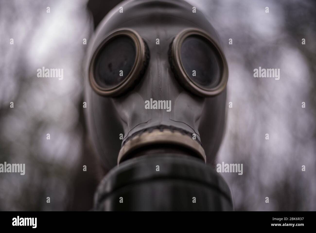 Close up of a man wearing a gas mask, in the forest Stock Photo - Alamy