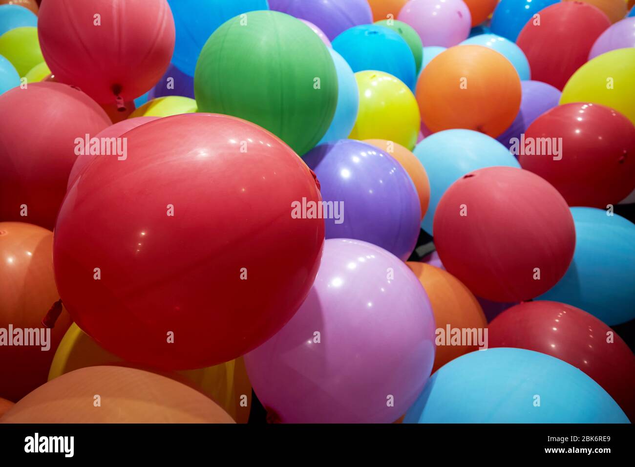 Many colorful balloons at a childrens party Stock Photo - Alamy