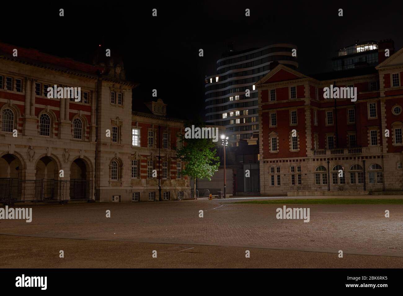 Night view of Chelsea College of Art parade ground with modern ...