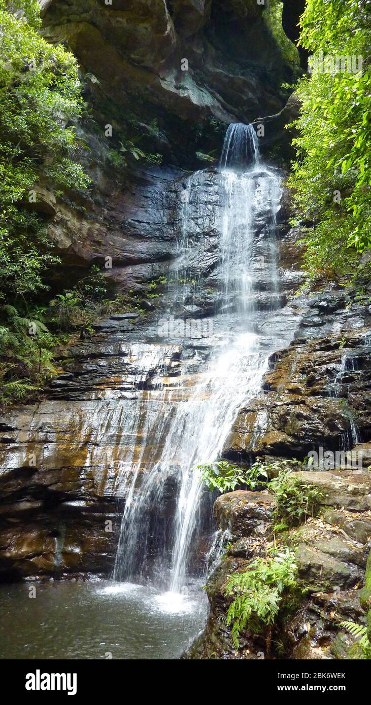 Water coming down from a Waterfall into a basin Stock Photo - Alamy